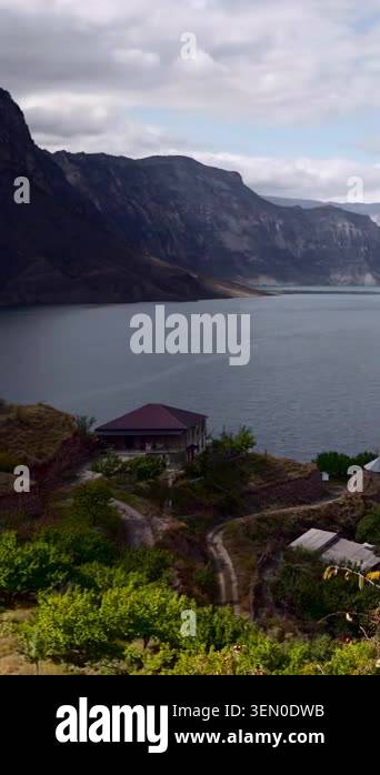 Mountain Inlet Village Framed By Rugged Peaks, Tranquil Water ...