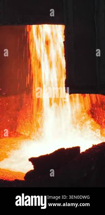 Molten Metal Waterfall Pouring Into Ladle Under Heavy Furnace Lip ...