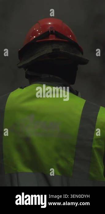 Site Observer In Highvisibility Vest And Hard Hat Watches Smoky ...