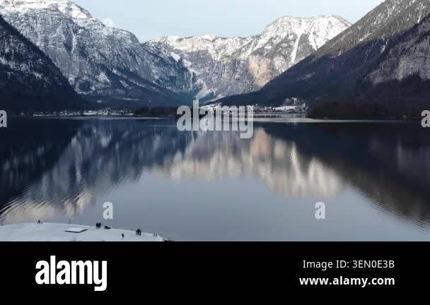 Mirror Calm Lake Reflecting Winter Town And Cliffs, Soft Dawn Light ...