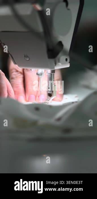 White Tailor Sewing Delicate Fabric On Industrial Machine, Closeup Of ...