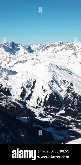 Aerial Ridge Flight Over Snowy Alps At Noon, Sweeping View Of Serrated ...