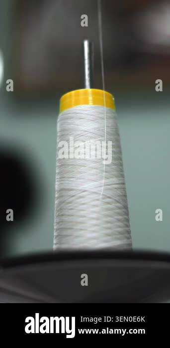 Macro Thread Spool With Blurred Operator Background. Two Tall Spools ...