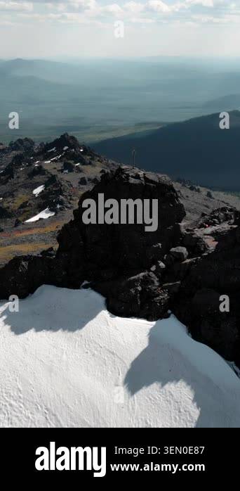 Snowfield Foreground With Craggy Summit View, Rugged Outcrops Framing ...