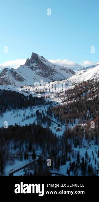 SnowCovered Alpine Valley With Sunlit Peaks, Dense Pine Forest On Lower ...