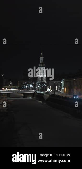 Distant Bell Tower Over Frozen Canal, Snowcovered Banks And Empty ...