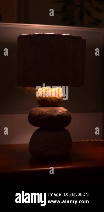 Dim Lamp With Textured Shade Casting Warm Glow, Bedside Table Scene ...