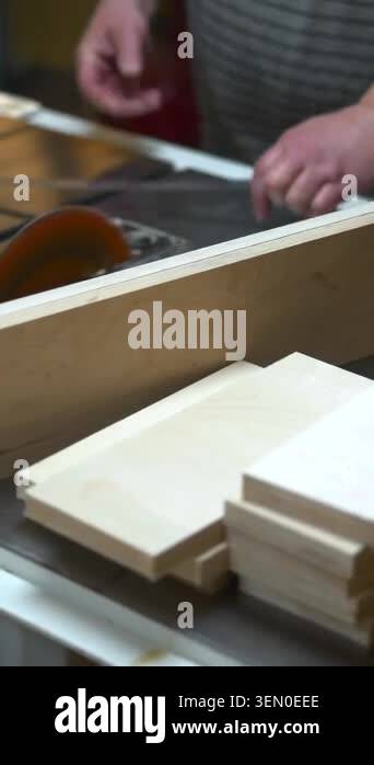 Focused Caucasian Carpenter Cutting Pine Boards On Table Saw, Hands ...