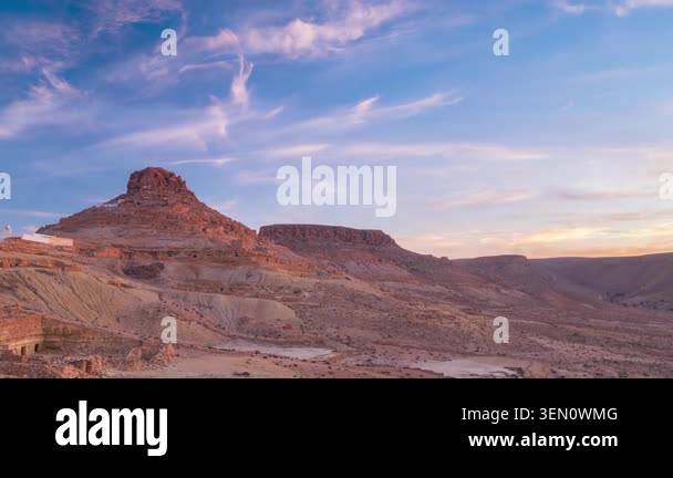 Timelapse: Ksar Guermassa hilltop berber village at sunset, rocky ...