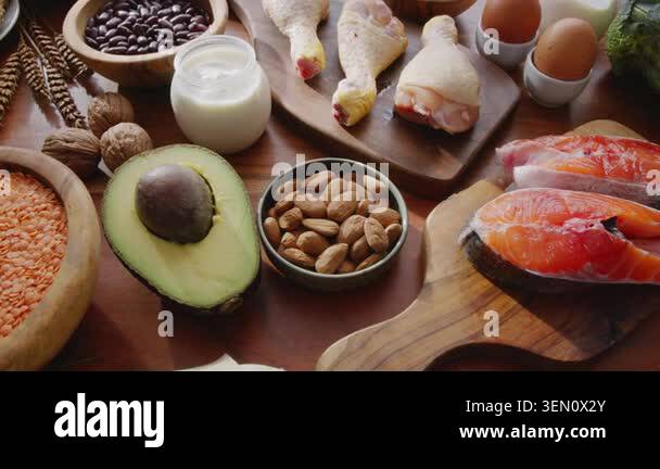 Slow camera movement along healthy food ingredients laid out on a ...