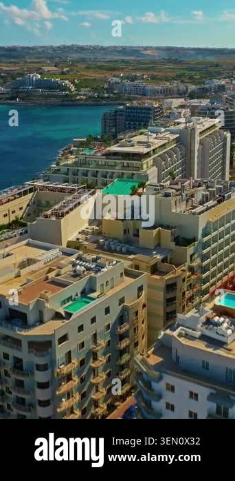 Aerial view of tourist apartments with a swimming pool on the island of ...