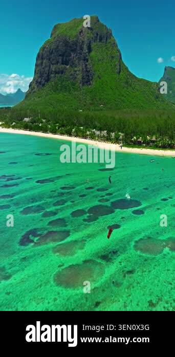 Aerial view of Le Morne Peninsula and sea lagoon formed by coral reefs ...