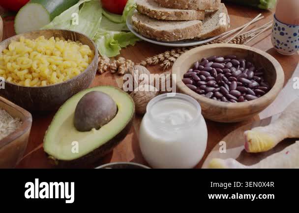 Slow camera movement along healthy food ingredients laid out on a ...