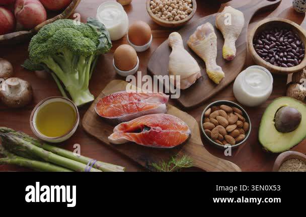 Slow camera movement along healthy food ingredients laid out on a ...