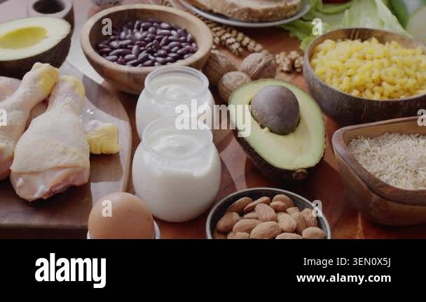 Slow camera movement along healthy food ingredients laid out on a ...