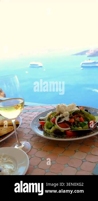 Greek salad and wine in Greece in a restaurant. Selective focus. Food ...