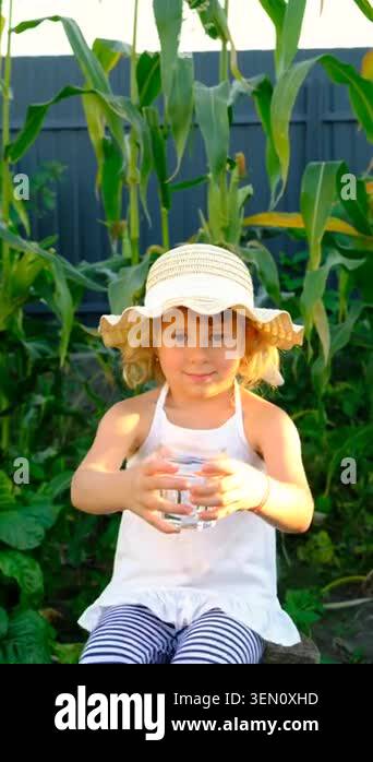 A child drinking water outside. Selective focus. Kid Stock Video ...