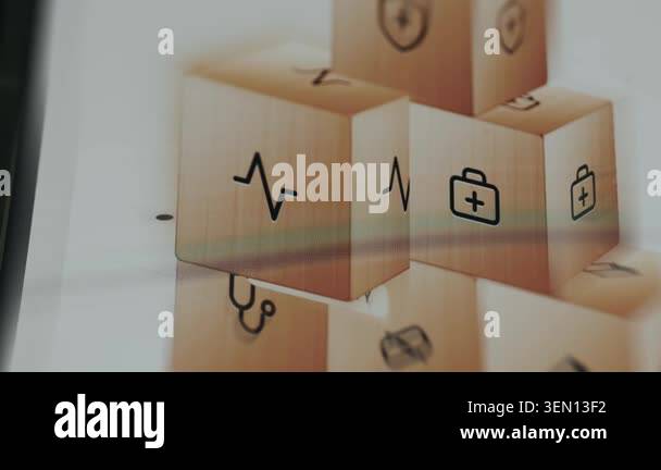 Wooden blocks stacked together with engraved medical-themed icons Stock ...