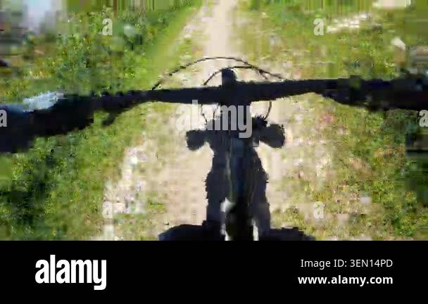 Man ride mountain bike in the mountain steep trail tough the forest ...