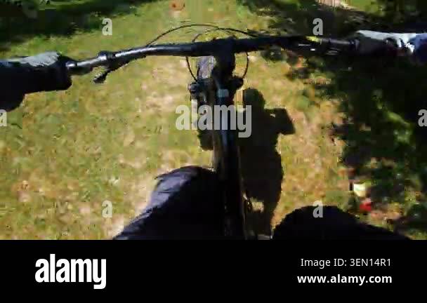 Man ride mountain bike in the mountain steep trail tough the forest ...