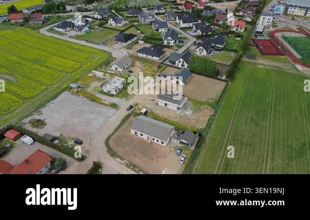 Aerial Footage of Suburban Residential Area with Curved Road and ...