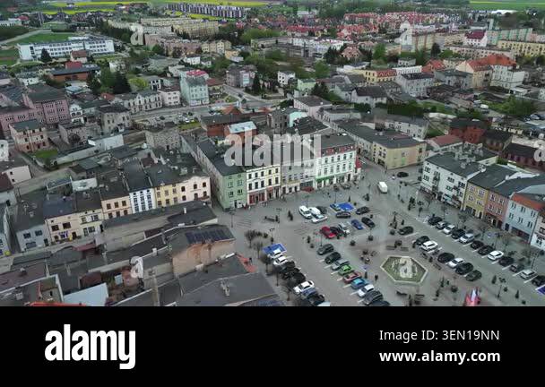 Aerial Footage of Town Square with Historic Buildings and Parking Area ...