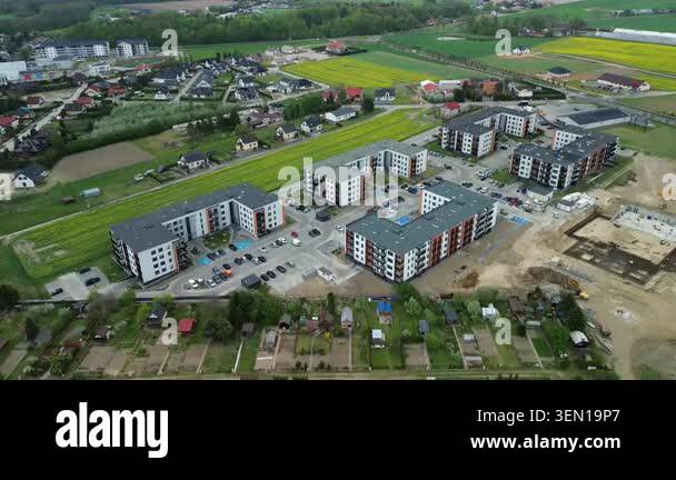 Aerial Footage of Modern Residential Building with Parking Area and ...
