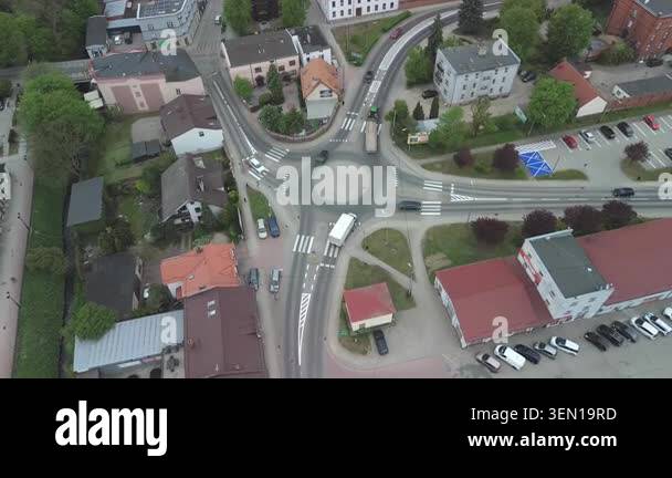 Aerial Footage of Urban Roundabout with Traffic and Residential ...