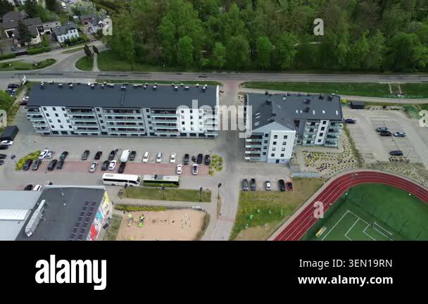 Aerial Footage of Modern Residential Building with Parking Area and ...