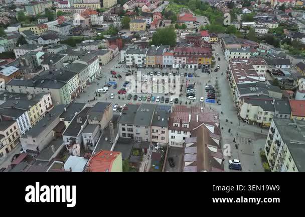 Aerial Footage of Town Square with Historic Buildings and Parking Area ...