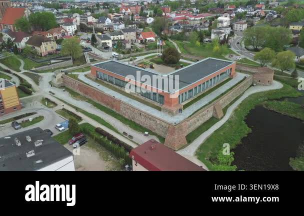 Aerial Footage of Modern Building with Glass Facade and Green ...