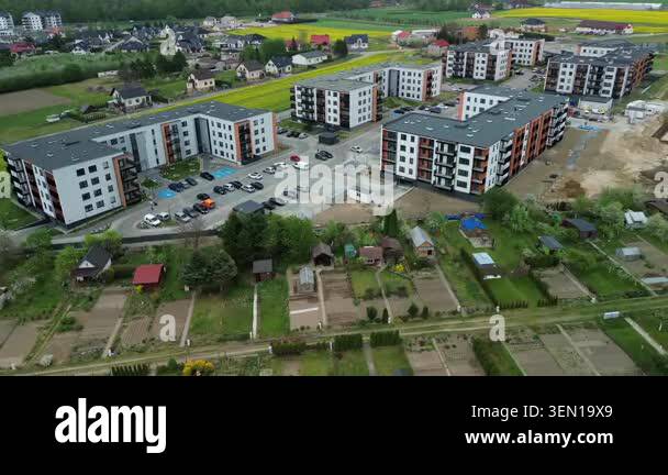 Aerial Footage of Modern Residential Building with Parking Area and ...