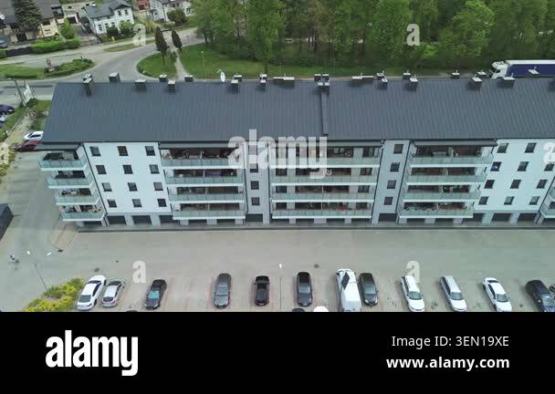 Aerial Footage of Modern Residential Building with Parking Area and ...