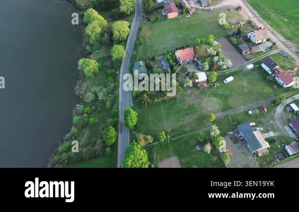 Aerial Footage of Rural Residential Area Near Lake and Forest Road 4K ...
