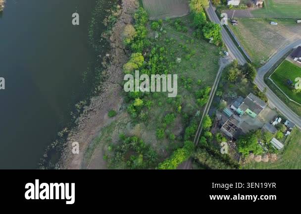 Aerial Footage of Rural Residential Area Near Lake and Forest Road 4K ...