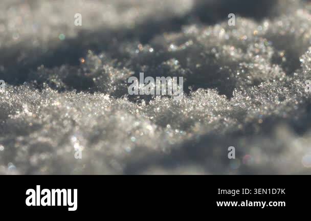 Close-up view of snow or frost that is sparkling under the light. Zoom ...