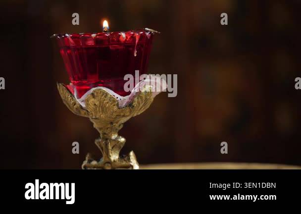 A candle burning in a church Stock Video Footage - Alamy