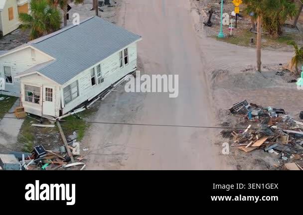 Trash from damaged houses after hurricane Milton storm surge. Piles of ...