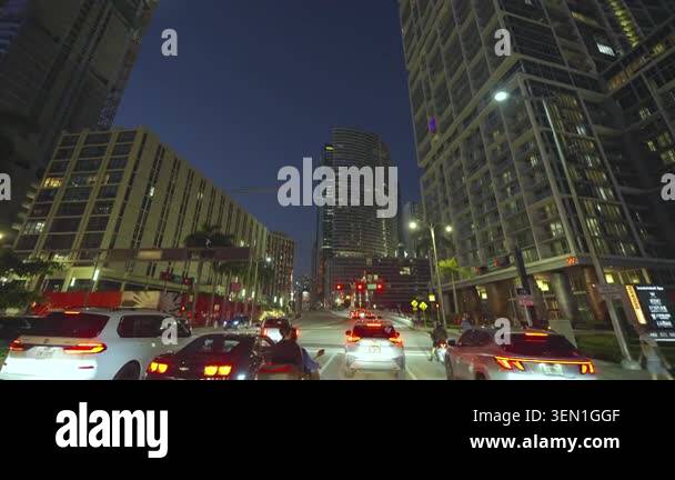 POV car driving on Miami streets at night. Urban American avenue ...