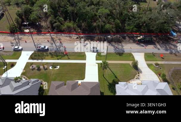 Street construction in Florida suburb with cars navigating single-lane ...