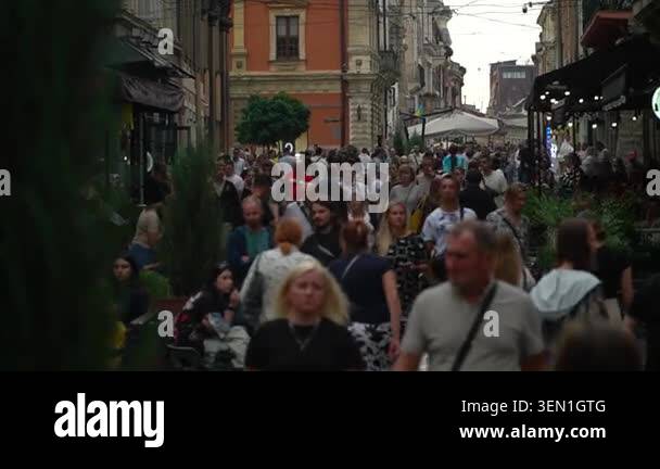 Lviv, Ukraine - 08, July, 2025: huge number people stroll along narrow ...