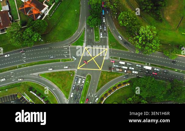 Aerial view of a busy intersection with cars moving through traffic ...