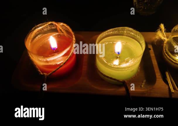 Group of burning candles on black background. Halloween candles burning ...