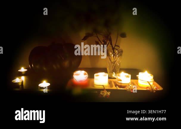 Group of burning candles on black background. Halloween candles burning ...
