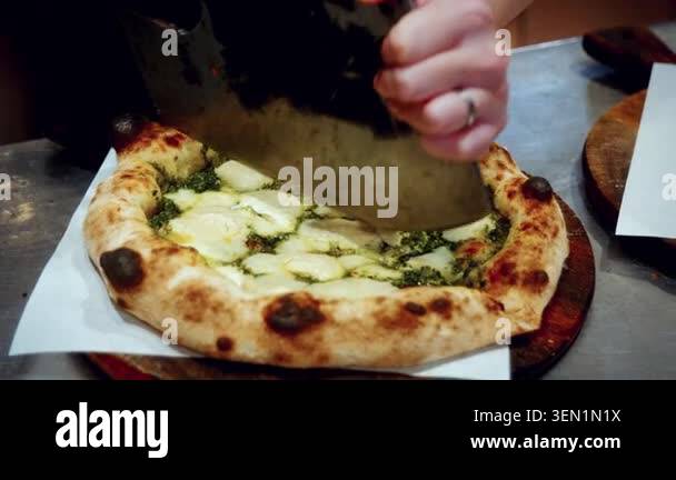 Authentic pizza making process in traditional Italian pizzeria, while ...