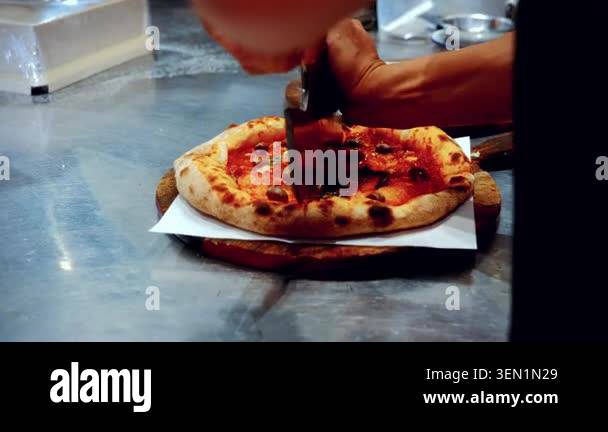Authentic pizza making process in traditional Italian pizzeria, while ...