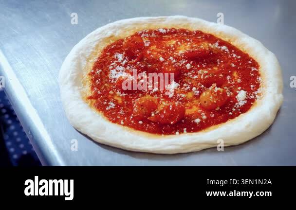 Authentic pizza making process in traditional Italian pizzeria, while ...