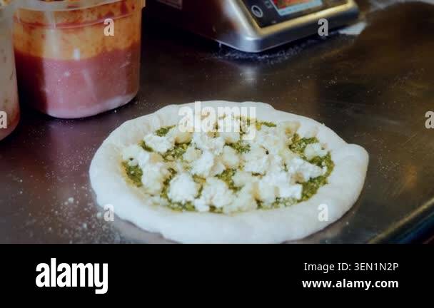 Authentic pizza making process in traditional Italian pizzeria, while ...