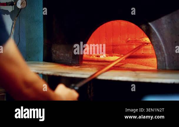 Authentic pizza making process in traditional Italian pizzeria, while ...