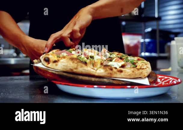 Authentic pizza making process in traditional Italian pizzeria, while ...